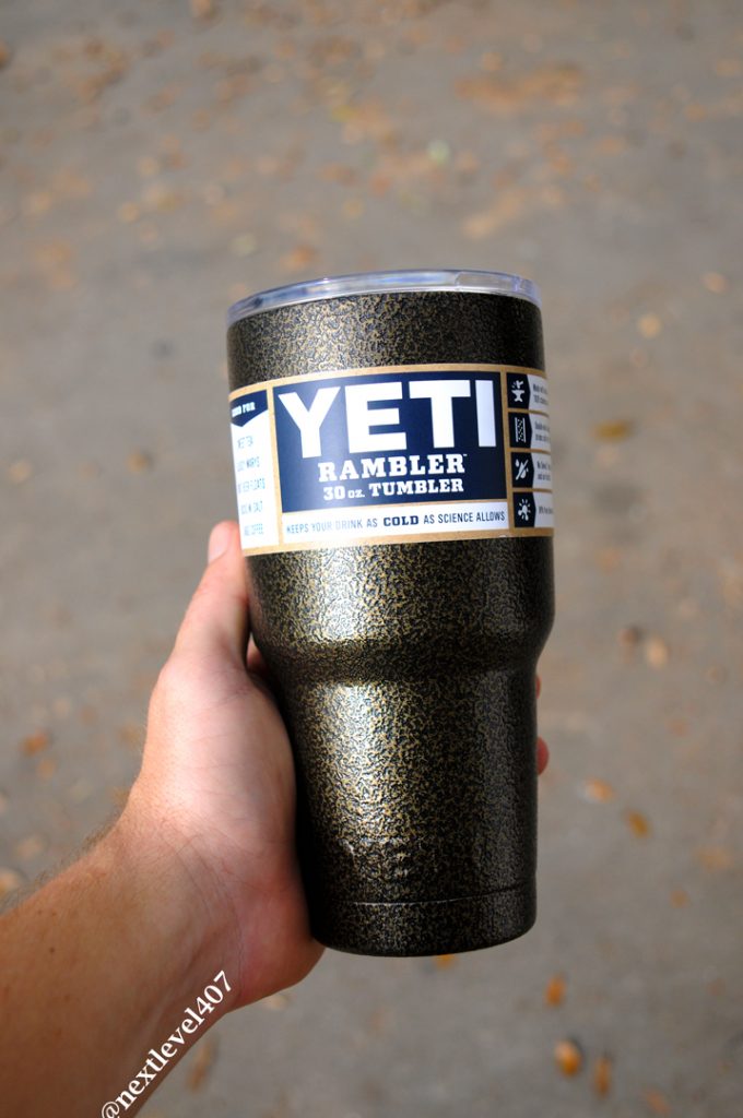 yeti-rambler-gold-and-yellow-holding | Orlando Custom Audio